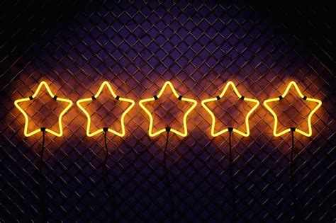3d Illustration Of The Five Neon Yellow Star Arrow On A Mesh Wall