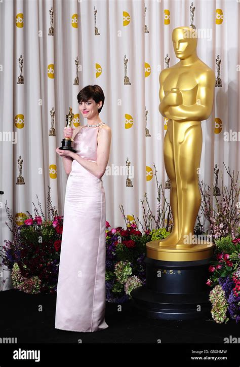Anne Hathaway With Her Oscar For Best Supporting Actress Received For