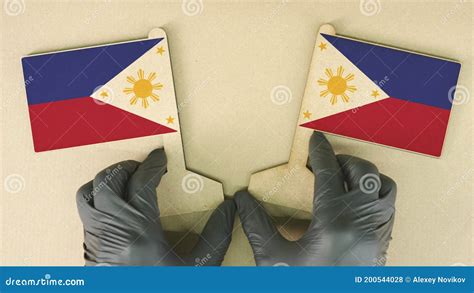 Flags Of Philippines Made Of Recycled Paper On The Cardboard Table