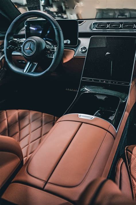 Luxury Car Interior With Brown Leather Seats And Electronic Display