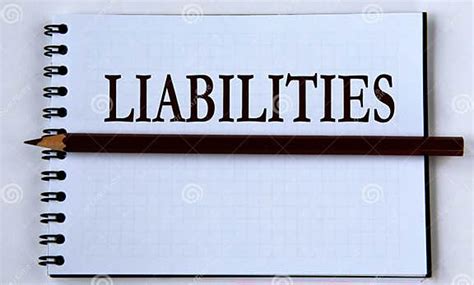 Liabilities Word In White Notebook On White Background With Pencil