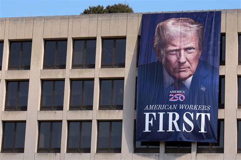 Donald Trump Hangs Giant Glorious Leader Flag With His Own Face On