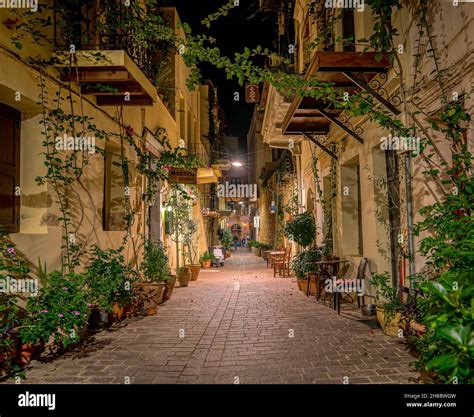 The Illuminated Narrow Alley Antoniou Gampa With Flowers And Balconies