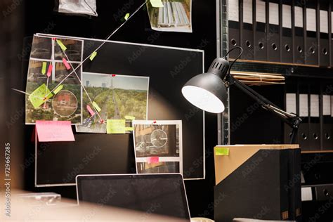 Crime Evidence Board With Investigation Process Map Lit With Desk Lamp