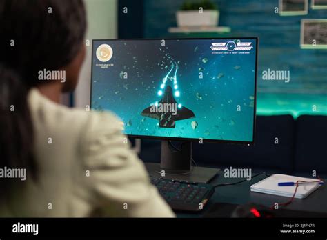 Successful Gamer Woman Holding Controller Playing Space Shooter Video Games During Online