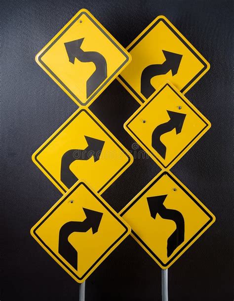 Group Of Four Yellow Road Signs With Black Arrows Stock Illustration