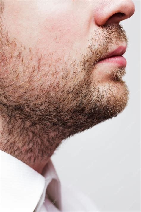 Premium Photo Man With A Threeday Unkempt Unshaven Stubble In White Shirt