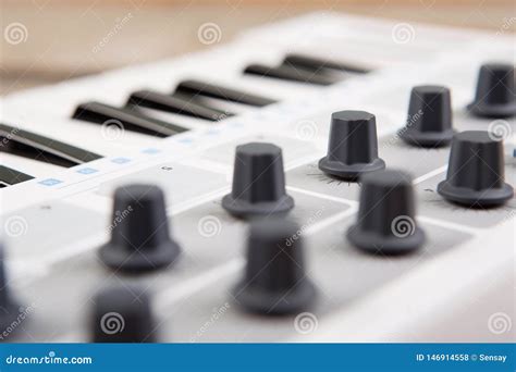 Close Up Of Midi Controller Volume Fader Knob And Keys Stock