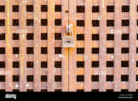 Rusty Gate With Lock Stock Photo Alamy