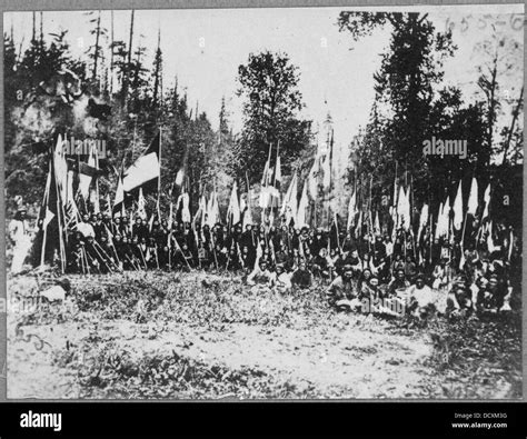 A Photograph Featuring A Group Of Indigenous People From British Columbia Reflecting The