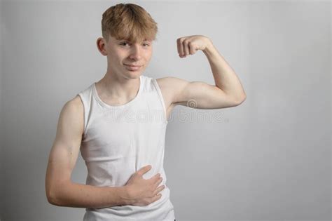 Teenage Boy Flexing His Bicep Stock Image Image Of Teenage Healthy