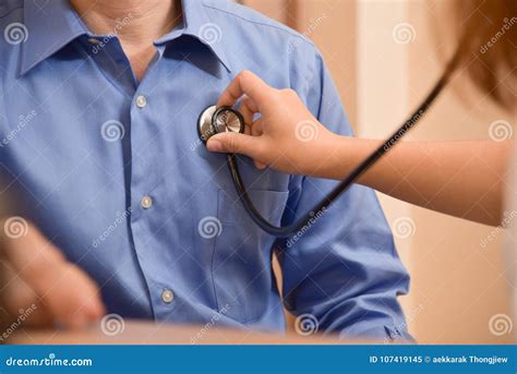 Female Doctor Examining Male Patient Stock Image Image Of Asian