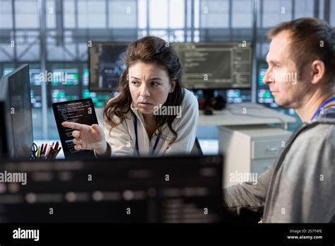 Team Of Data Center Programmers Brainstorming Ways Of Ensuring Minimal Downtime Teamworking