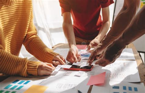 Ux Developer And Ui Designer Brainstorming About Mobile App Interface Wireframe Design With