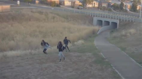 Girls Bolt After Lighting Fire Under Overpass On Summers Night