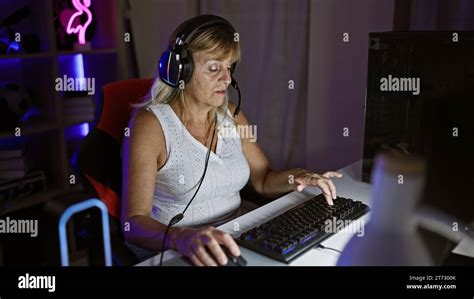 Beautiful Middle Age Blonde Woman Streamer Seriously Immersed Wearing