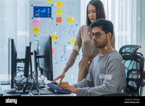Asian And Indian Developer Team Discussion Feedback Analysis Coding Data With Software Computer
