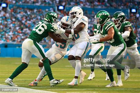 Jaylen Wright Of The Miami Dolphins Runs The Ball Against Brandin