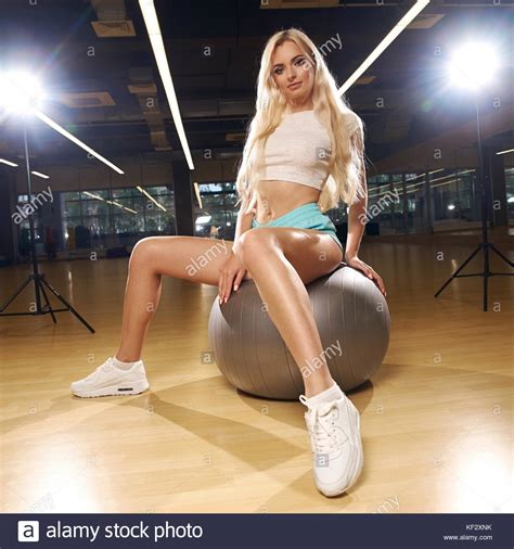 Pretty Slim Blonde Woman With Long Hair Dressed In White Crop Top
