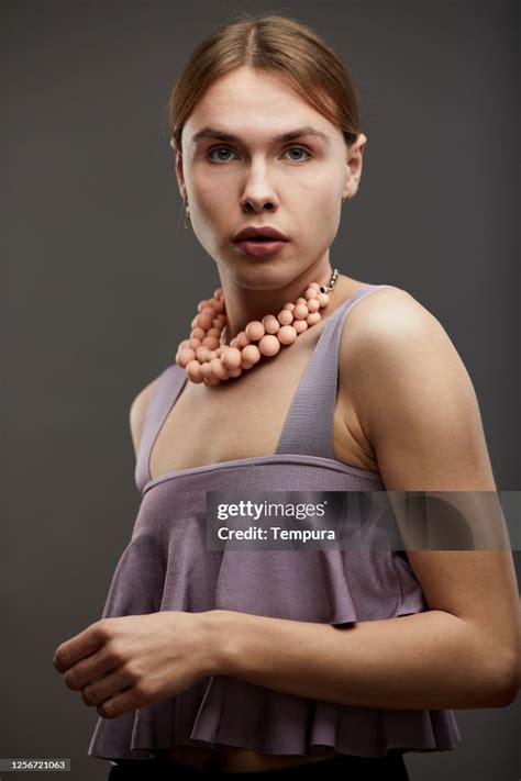 A Cross Dressing Man Studio Portrait On Plain Backgorund High Res Stock