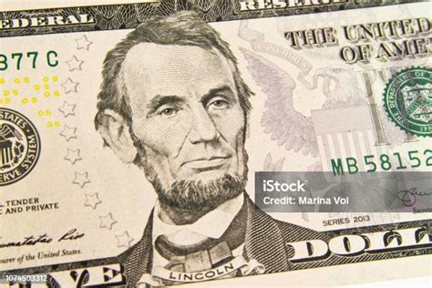 Front Of The Five Dollar Bill With A Portrait Of President Abraham