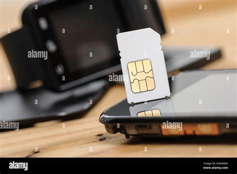 Mini Size Of SIM Card With Smart Phone Stock Photo Alamy