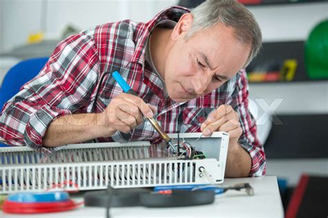 The Small Parts Assembler Stock Image Colourbox