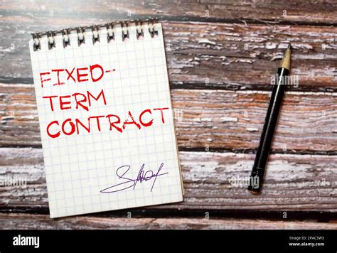 Top View Clock And Miniature People With Text Fixed Term Contract On A