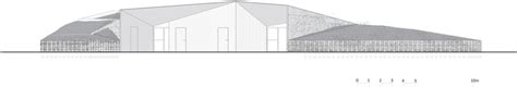 Mu Architecture Hides Locker Rooms Under Plant Covered Mound