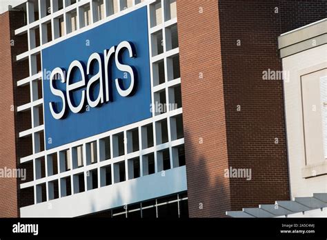 A Logo Sign Outside Of A Sears Retail Store Location In Greensboro North Carolina On September