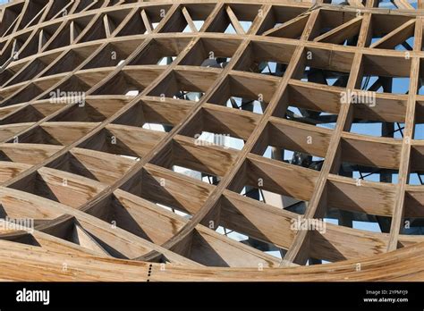 Abstract Curved Wooden Framed Sections Of Decorative Wall Or Shade Roof Hardwood Timber Grid Abstract Curved Wooden Framed Sections Of Decorative Wall Or Shade Roof Hardwood Timber Grid