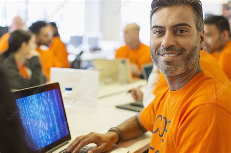 portrait hacker at laptop coding at hackathon stock image f022 2971