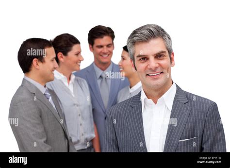 Mature Manager Standing With His Team Against A White Background Stock