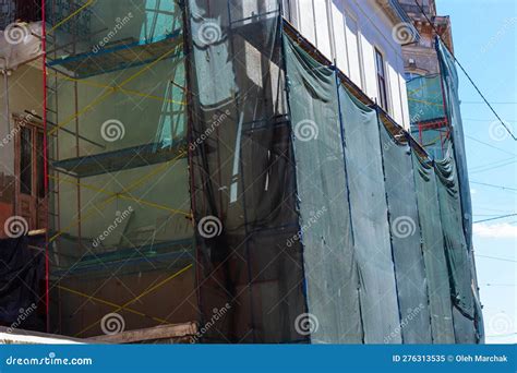 Restoration Of The Building Scaffolding And Protective Green Building Mesh Stock Image Image