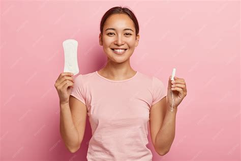 Free Photo Horizontal Shot Of Happy Korean Woman Holds Sanitary