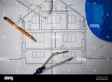Architectural Project Being Designed With Pencil Compass And
