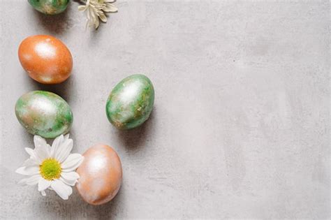 Premium Photo Colourful Ester Eggs And Flowers Light Background