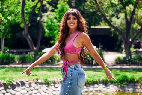 Beautiful Mature Latina Arab Brunette Dancing In An Outdoor Park Stock