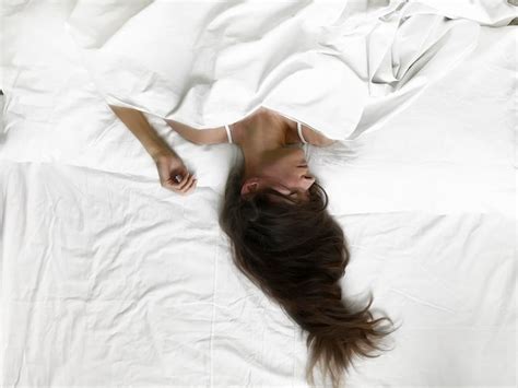 Premium Photo High Angle View Of Woman Sleeping On Bed