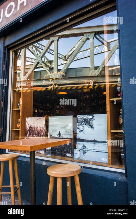 Reflection In Coffee Shop Window Of Victorian Railway Bridge Stock