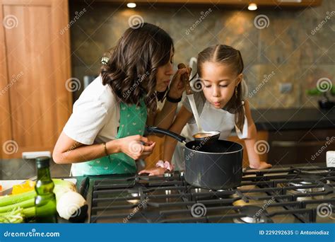 Mom And Girl Preparing Dinner Together Stock Image Image Of Home