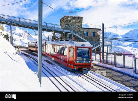 Cogwheel Train Of The Gornergrat Railway Descending A Steep Slope At