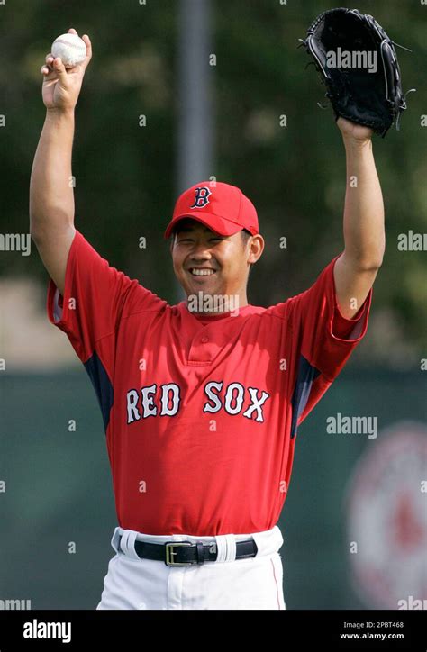 Boston Red Sox Pitcher Daisuke Matsuzaka Raises His Arms During A Team Practice Prior To A