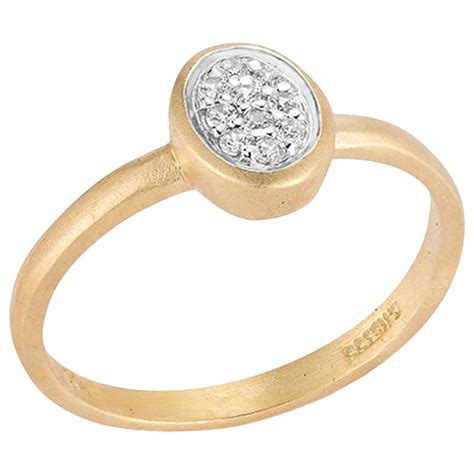 Handcrafted 14 Karat Yellow Gold Cut Out Ring With A Pave Oval Motif