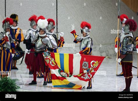 The Swiss Guard Seen Taking An Oath Of Office While Holding The Flag Of
