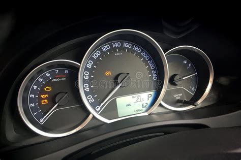 Detail Of Dashboard Of Modern Car With Odometer And Instruments Showing Values As Rpm And Fuel