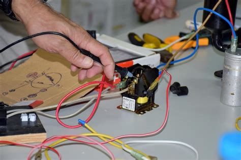 Premium Photo Cropped Image Of Engineer Testing Wires