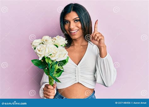 Young Latin Transsexual Transgender Woman Holding Flowers Smiling With