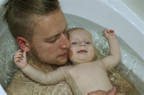 Premium Photo Cheerful Father And Son Taking Bath At Bathroom