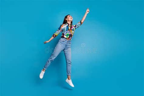 Full Size Photo Of Gorgeous Girl Dressed Print Blouse Jeans Pants Flying Catch Object Look Empty